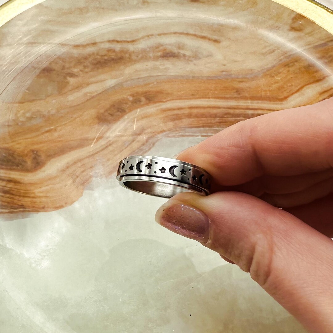 Stainless Steel Celestial Spinner Ring - Moon, Stars, and Sun Black and ...