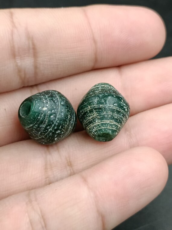 Ancient Pair Of PYU Spindle Whorl Green Glass Shell S… - Gem