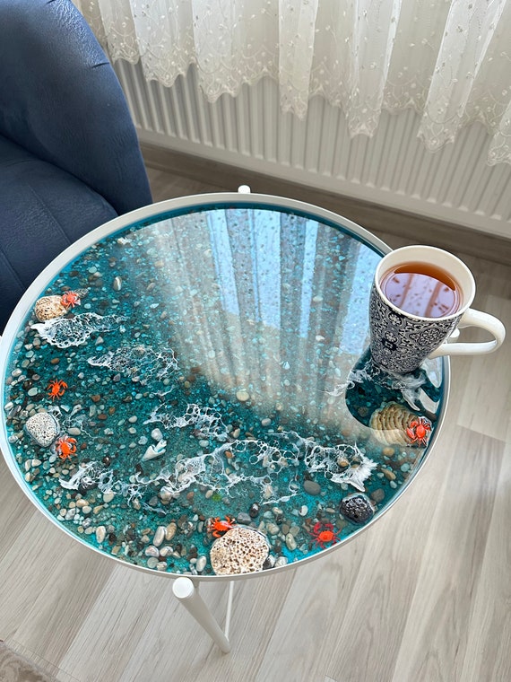 Glass coffee table with pebbles store