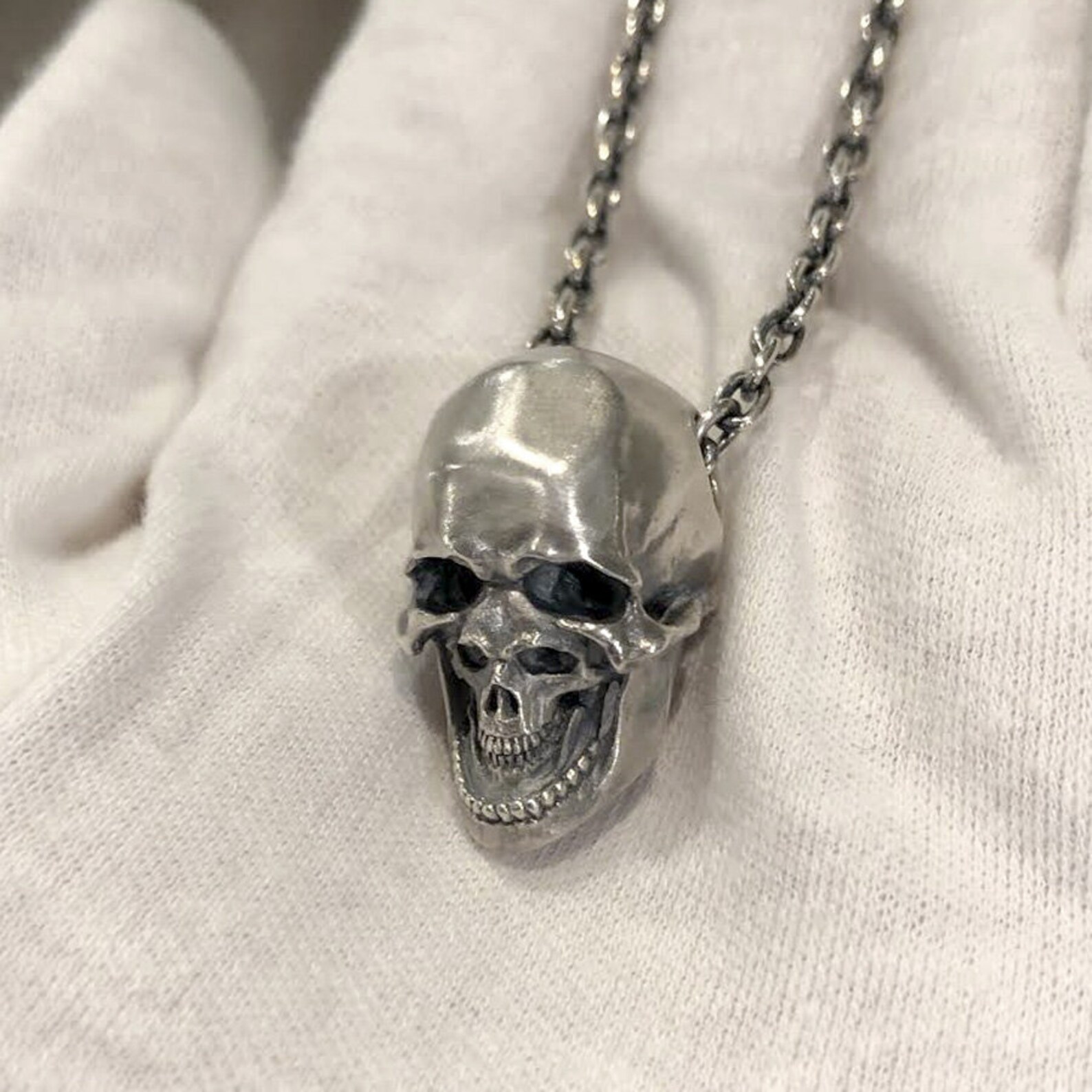 Dual skull pendant | Etsy