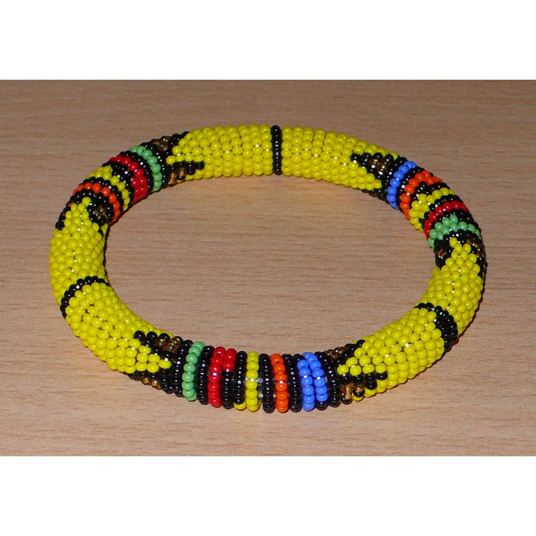 Yellow African bracelet / Zulu jewelry with tribal patterns / - Etsy.de