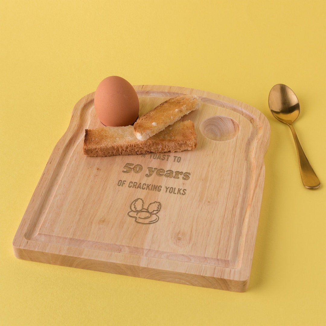 A Toast to 50 Years of Cracking Yolks Egg and Toast Board - Milestone ...