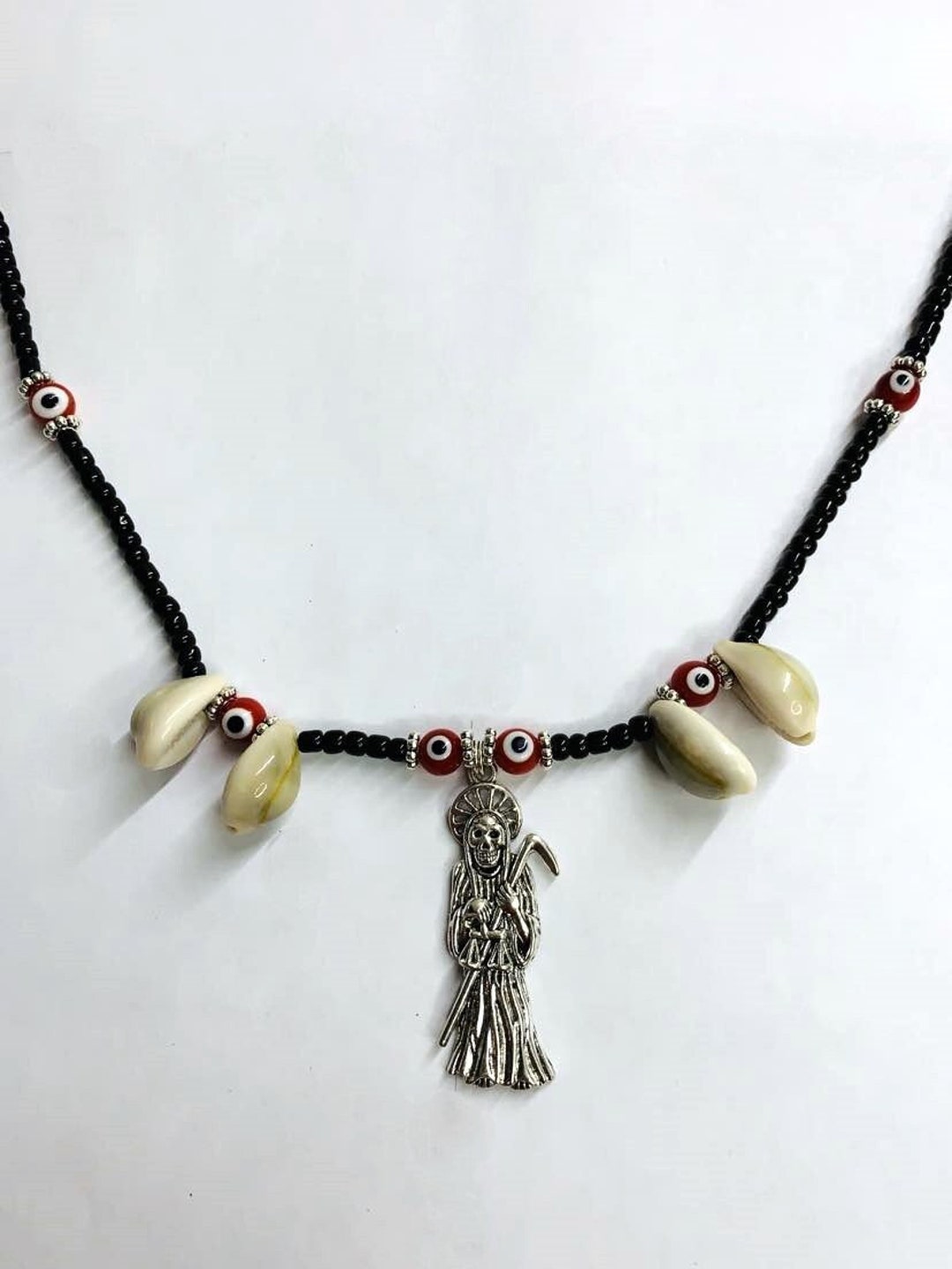 Santa Muerte Necklace: Evil Eye & Cowrie Shell Protection Amulet - Etsy