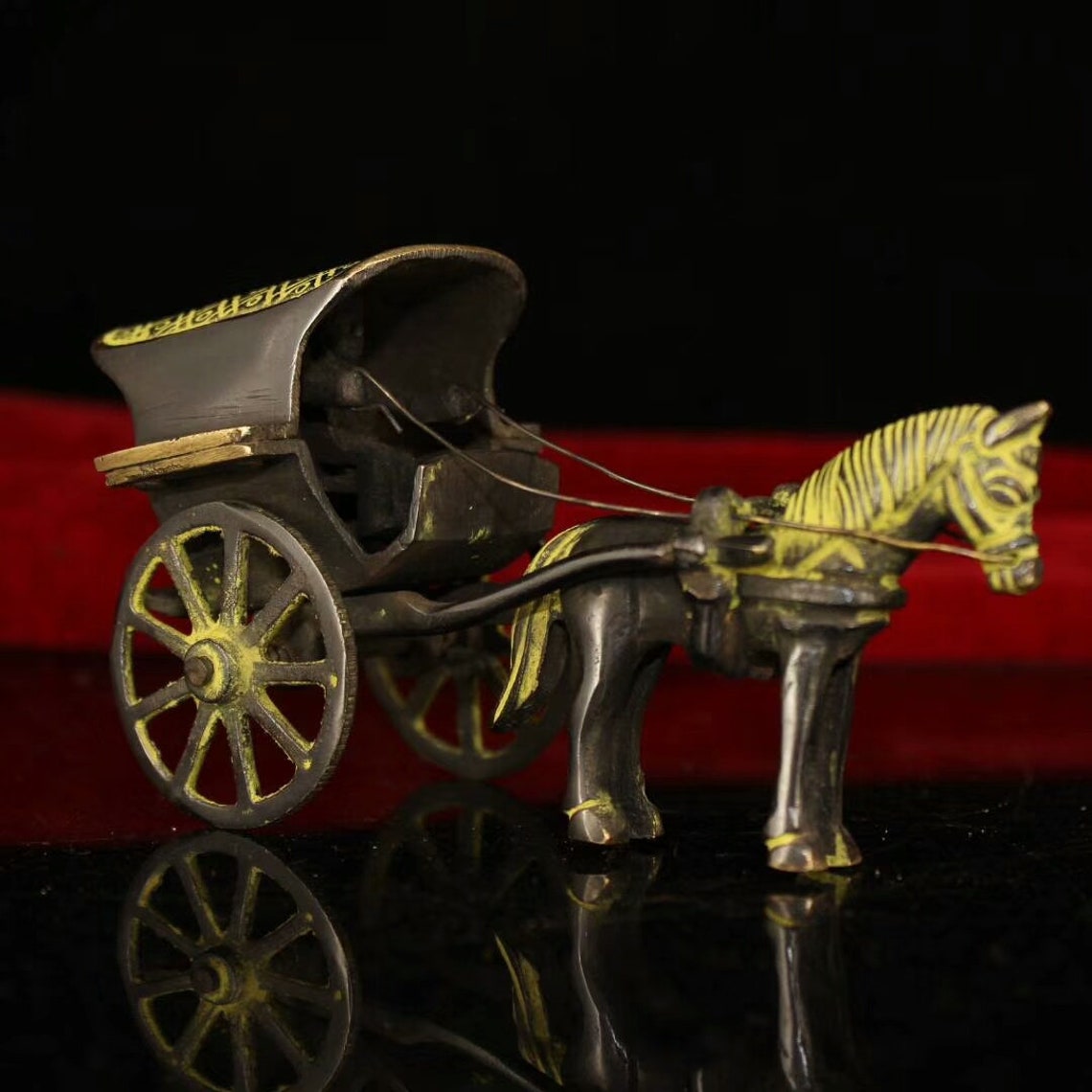 Hand-drawn carriage collecting bronze statues | Etsy