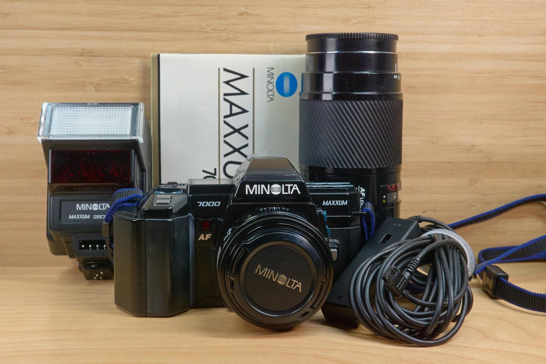 Minolta Maxxum 7000 SLR Film Camera, Minolta AF 50mm F1.7 and 70-210mm F4 Lens, Minolta 2800 Af ...