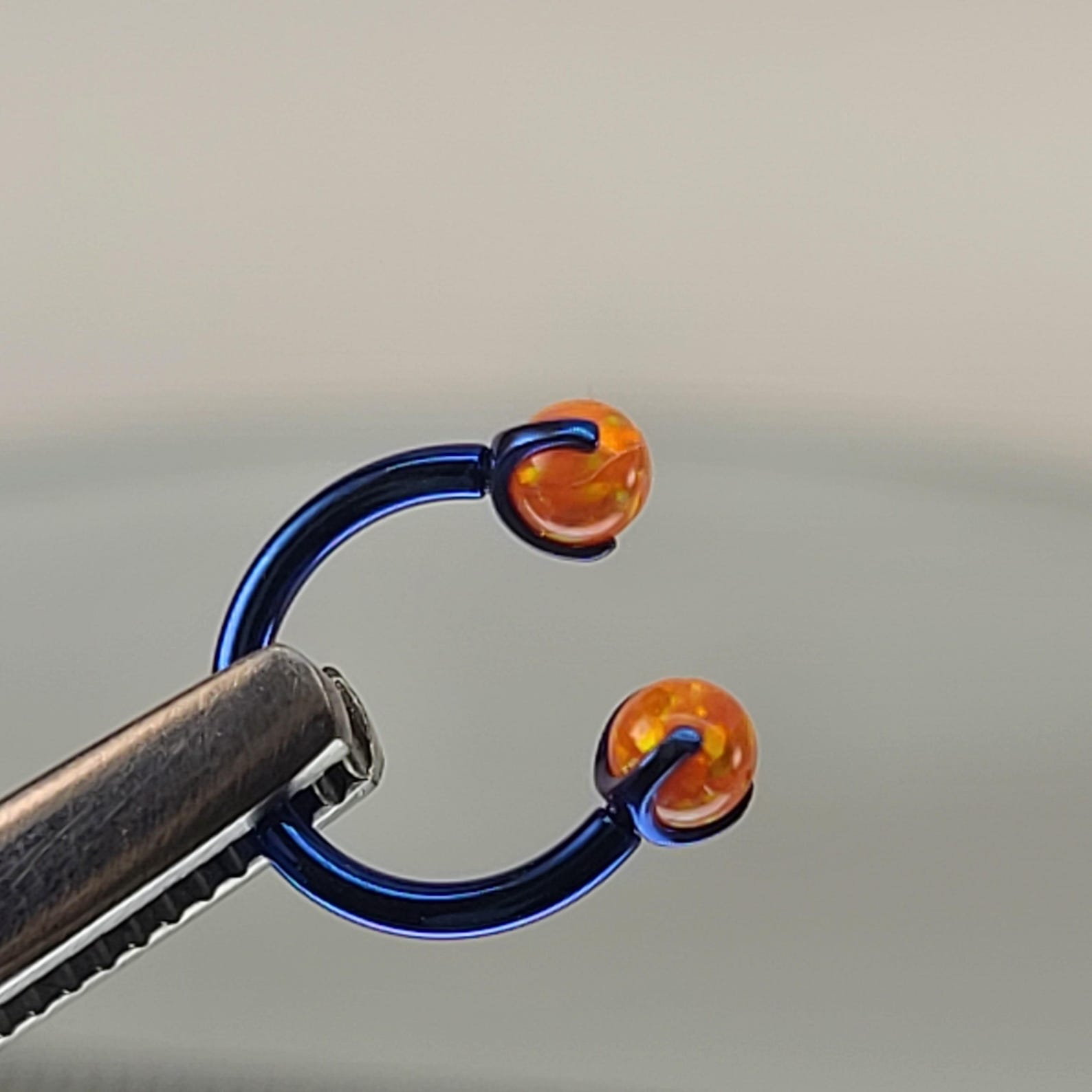 16g Titanium Horseshoe Internally Thread W/3mm Orange Claw Opal Ends ...