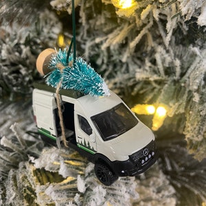 Mercedes Benz Sprinter Camper Van Carrying Christmas Tree Christmas ...