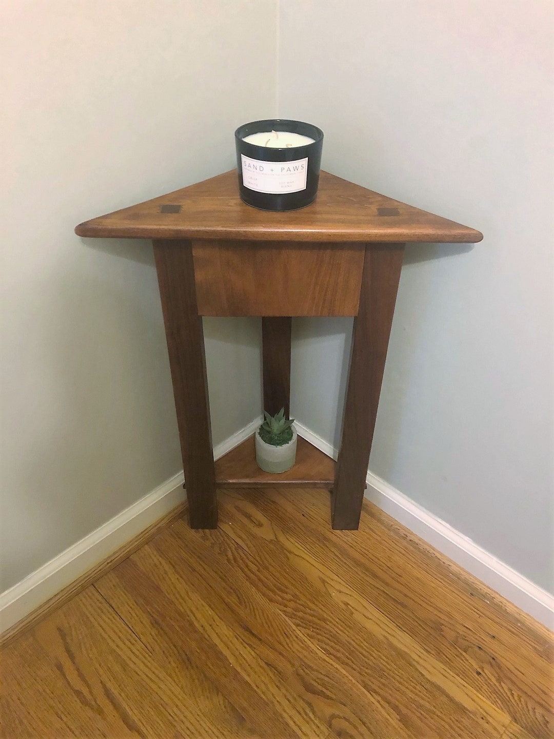 Slim corner table store