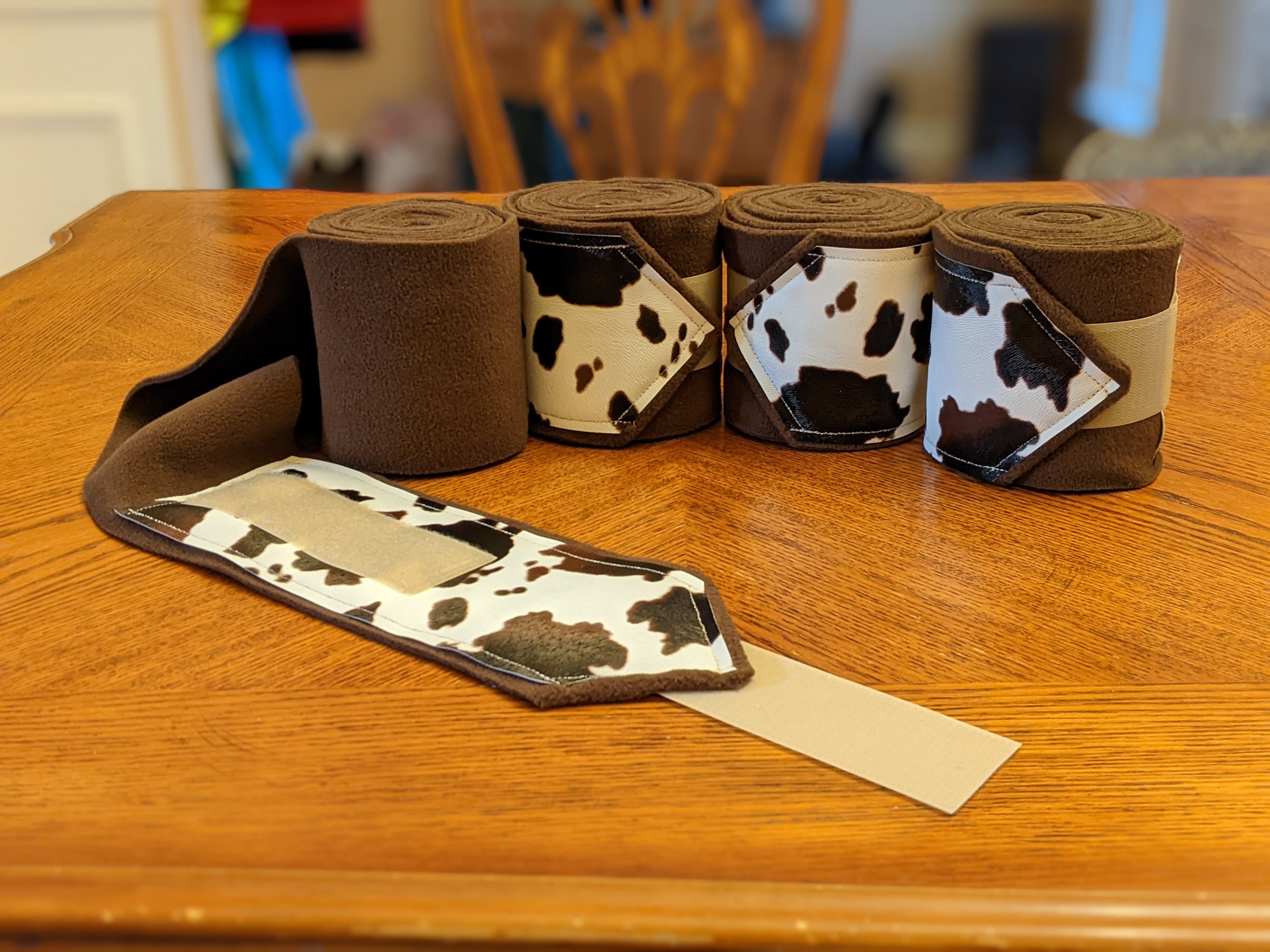 Brown Cow Print Polo Wraps, Cow Print Vinyl Over Warm Brown Fleece ...