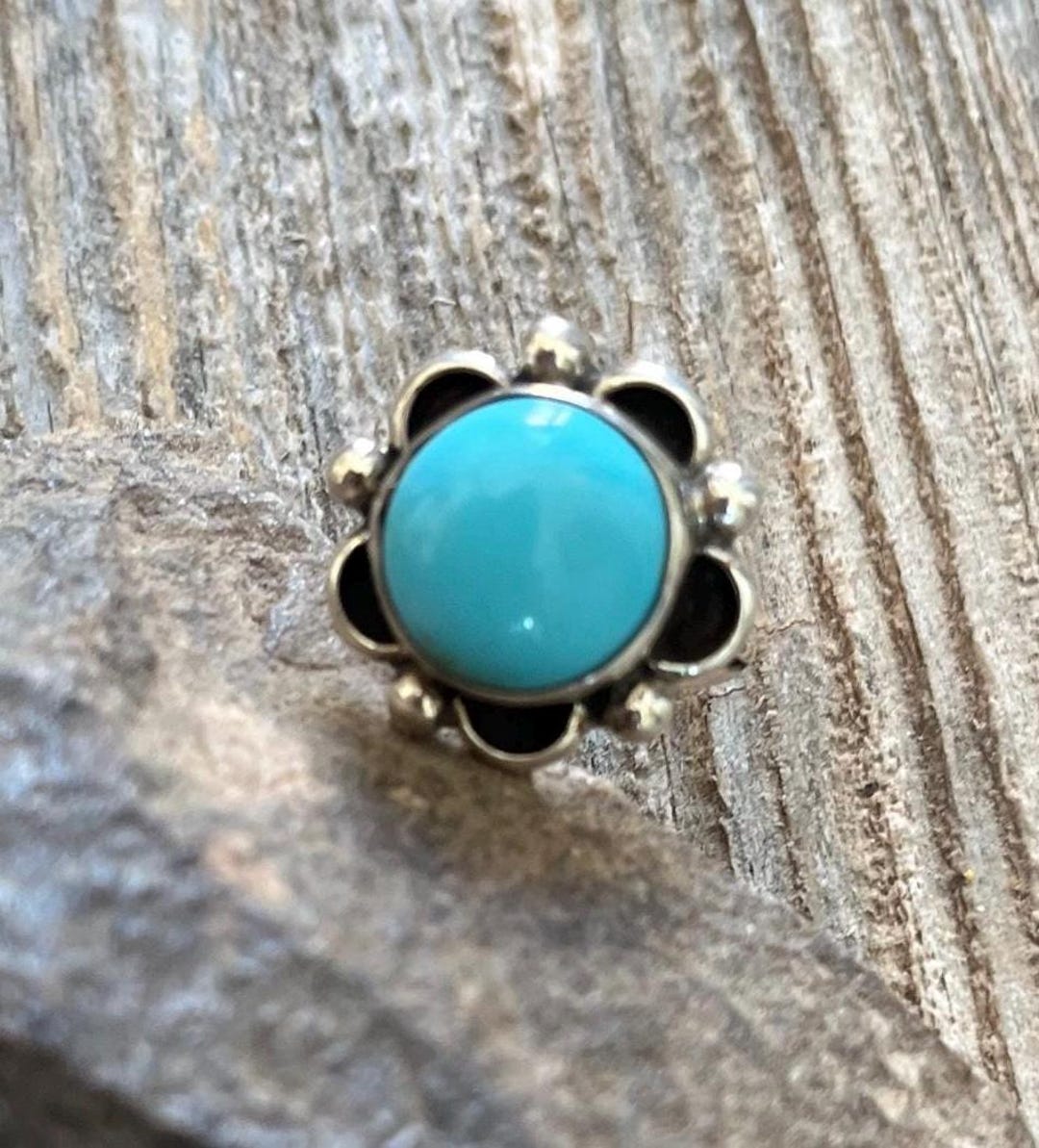 Eye-catching Turquoise Stone Set in a Sterling Silver Flower Setting ...