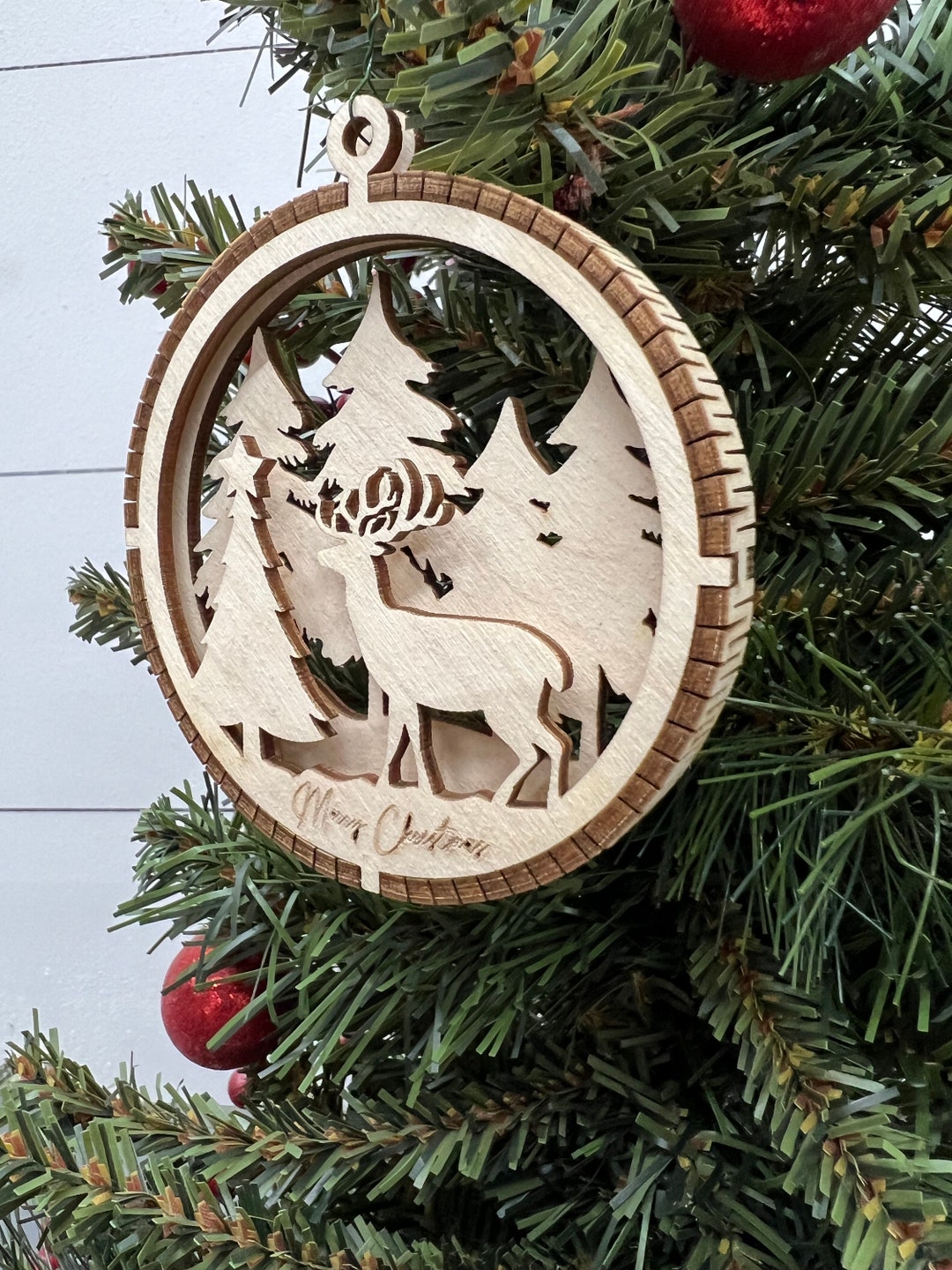 This is a Round Wooden Christmas Ornament With a Winter Scene With a ...