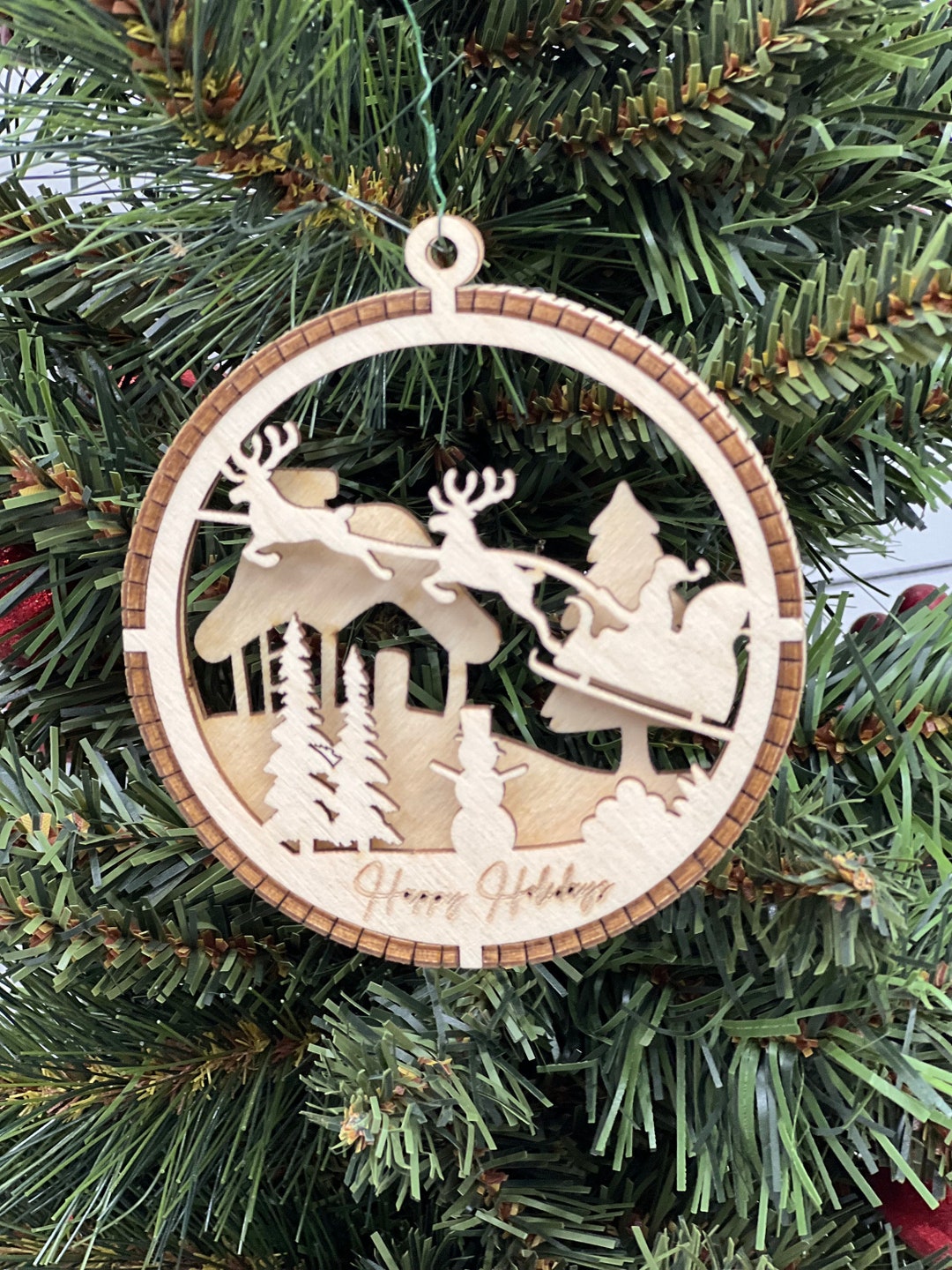 This is a Round Wooden Christmas Ornament With a Winter Scene With a ...