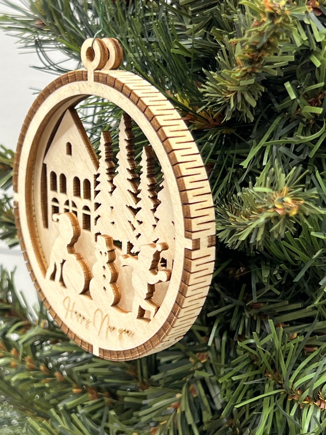 This is a Round Wooden Christmas Ornament With a Winter Scene With a ...