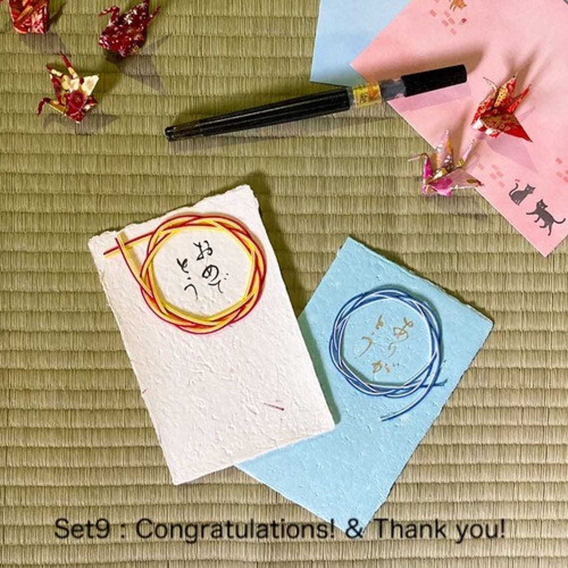 水引飾り付き、手漉きハガキ。 書が書かれています。（Handmade postcard with mizuhiki decoration ...