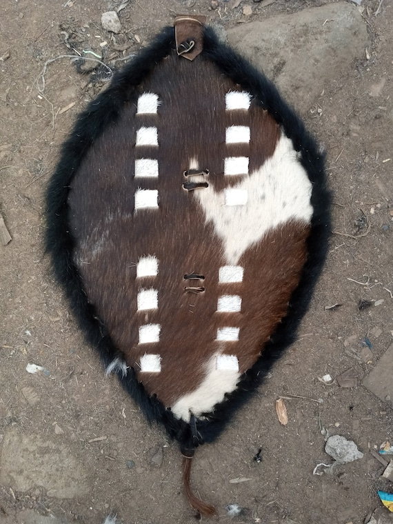 Zulu Shield A Typical Zulu Shield And Weapons Over A Photo & Art Print