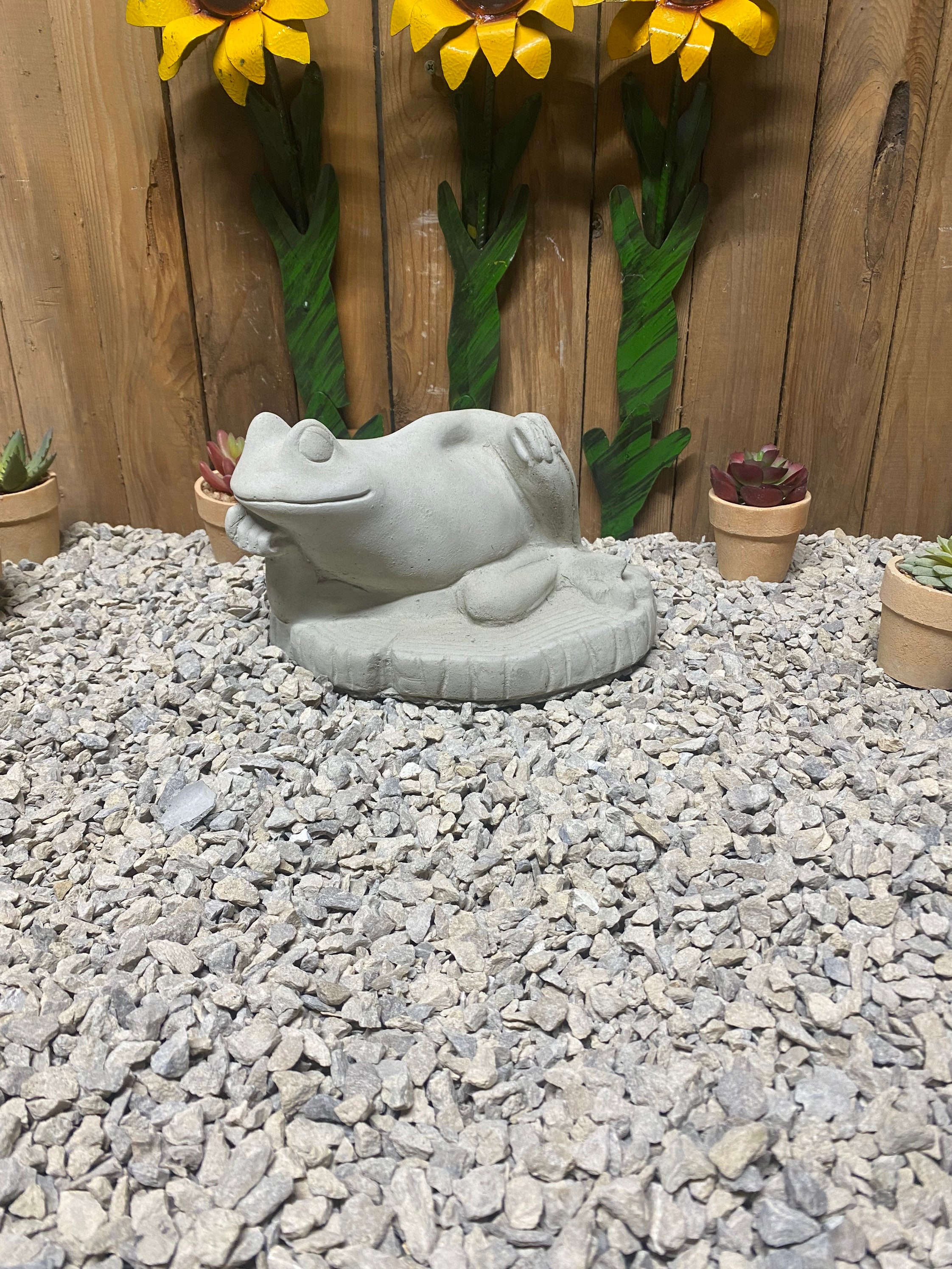 Relaxing frog concrete statue