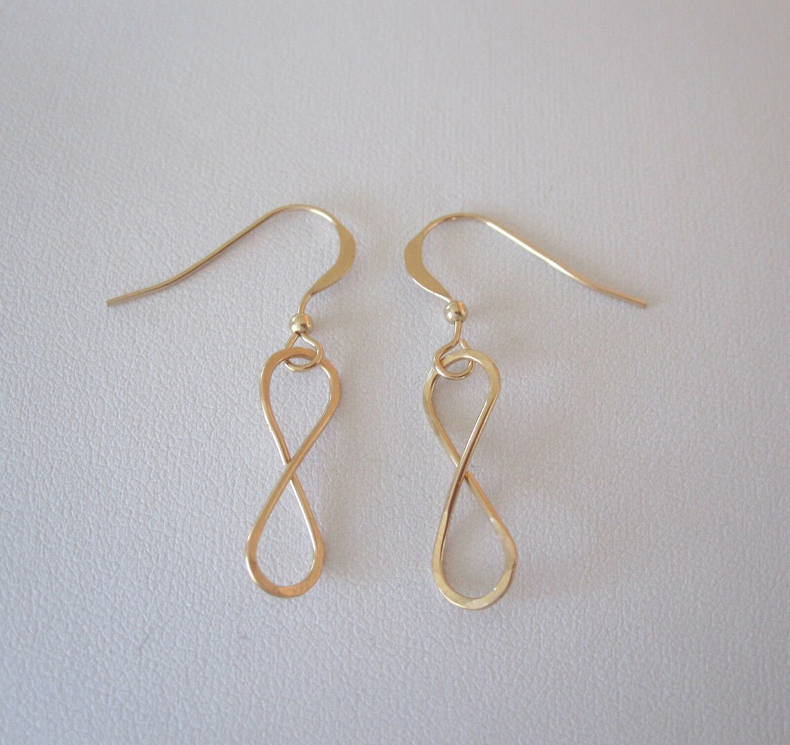 A Pair of Infinity Eternity Symbol Wire Earrings in 925 Sterling Silver ...