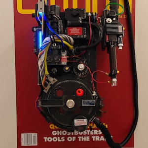 Ghostbusters Proton Pack Display: OMNI Magazine Wall Decal / Poster ...