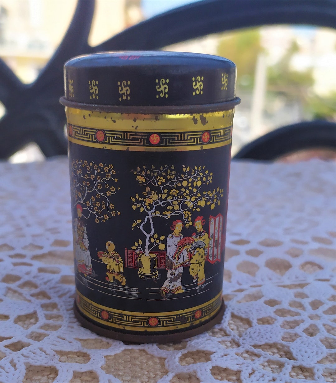 Small Rusty Tin Storage in Cylindrical Shape and Geishas Japan Scene ...