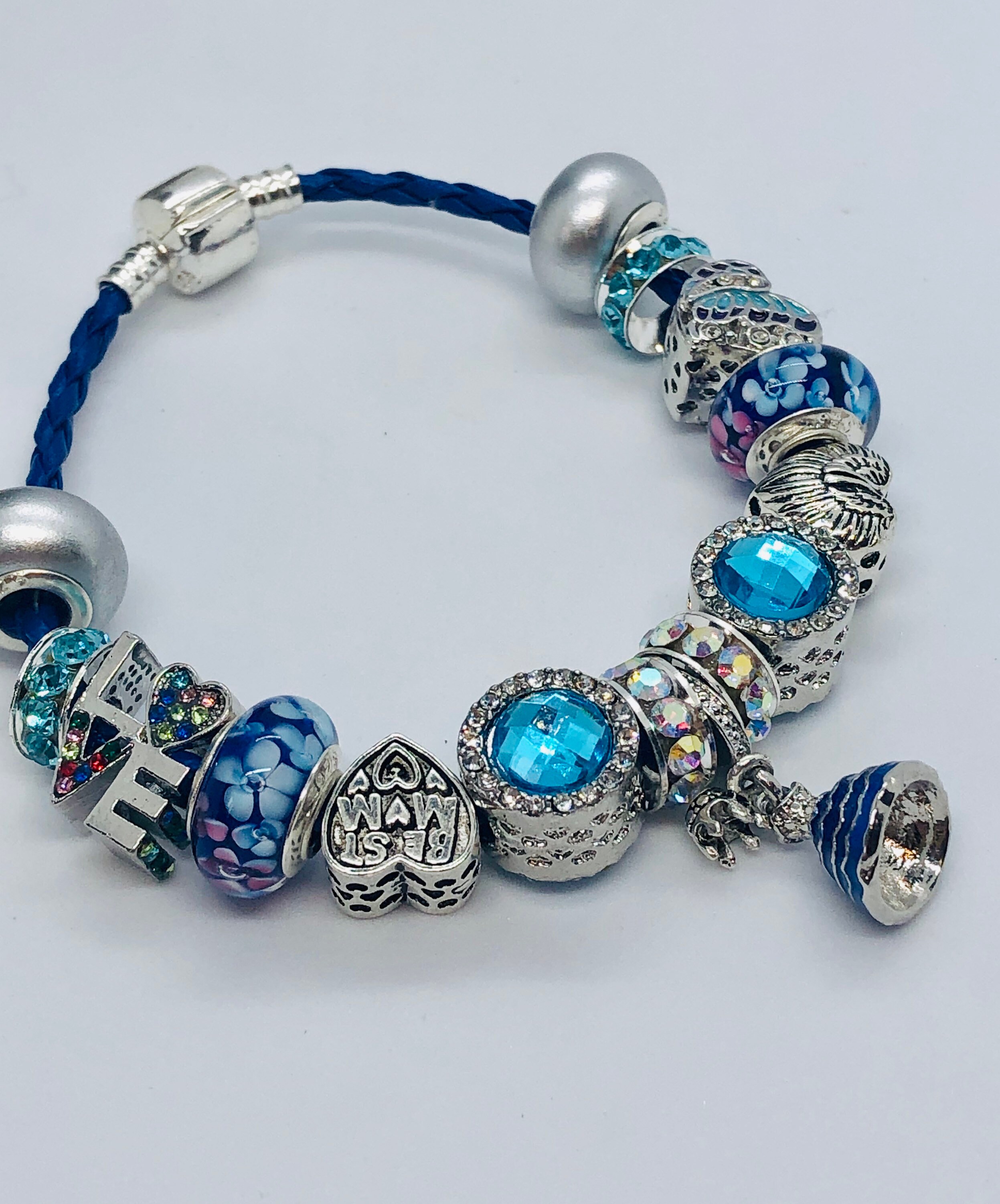 Pandora like charm bracelet. European fit. BALL GOWN and CROWN loaded. Great gift. Murano beads and wonderful blue charms. Leather Etsy