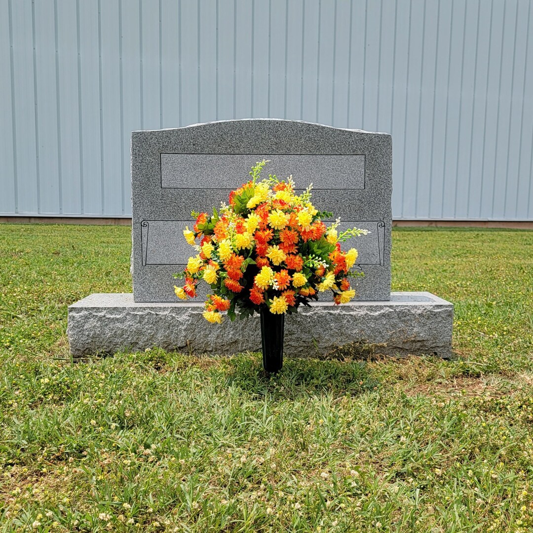 This Jumbo Cemetery Cone Has Grave Flowers Including Orange and Yellow ...