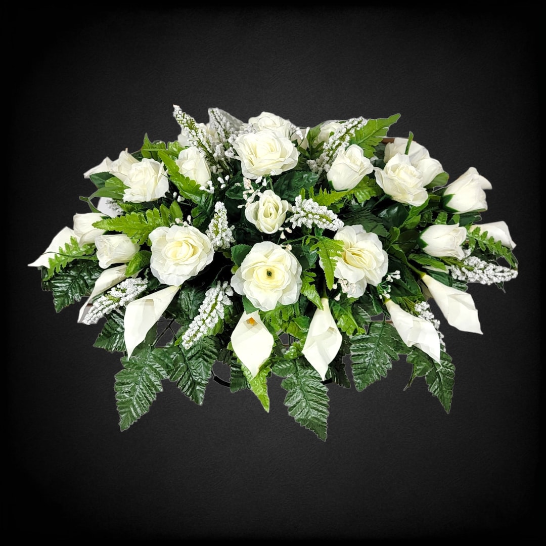 This Headstone Saddle Has Silk Grave Flowers Including Cream Calla ...