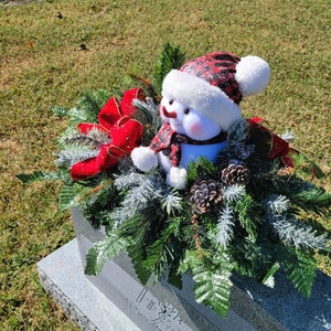 This Chubby Snowman Christmas Cemetery Saddle Has Greenery and a Red ...