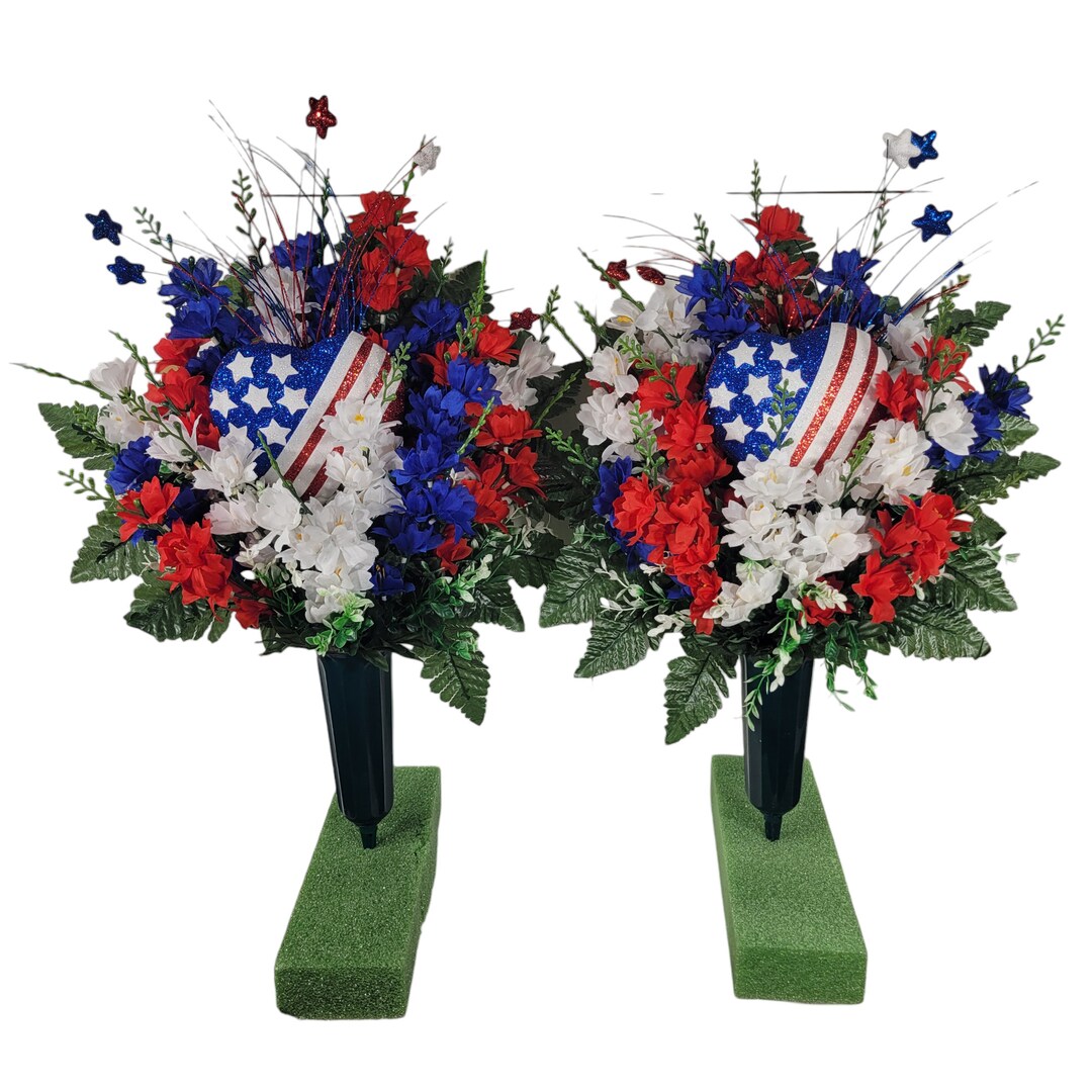 This Pair of Cemetery Cones Has Grave Flowers Including Red, White ...