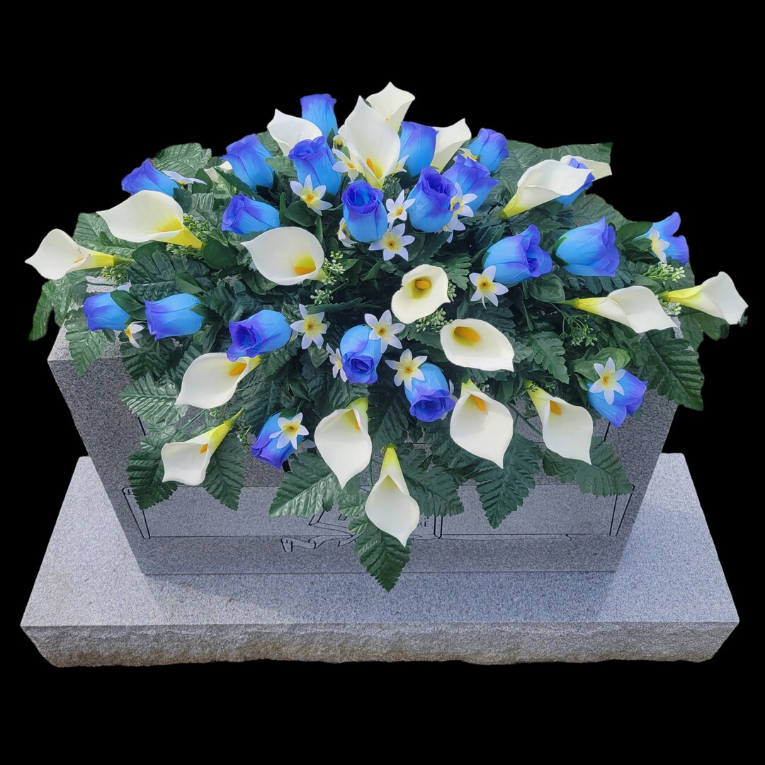 This Headstone Saddle Has Silk Grave Flowers Including Baby Blue Calla ...