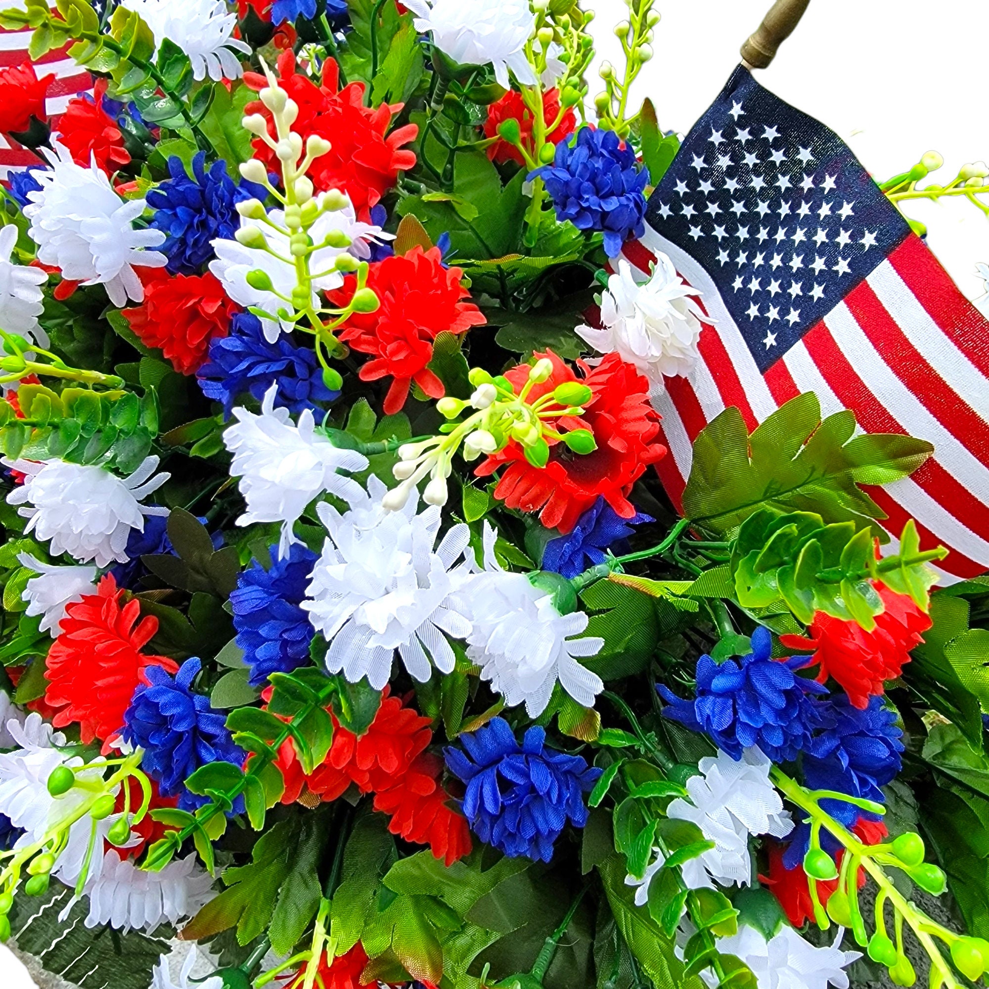 This Headstone Saddle Has Grave Flowers Including Red, White, & Blue ...