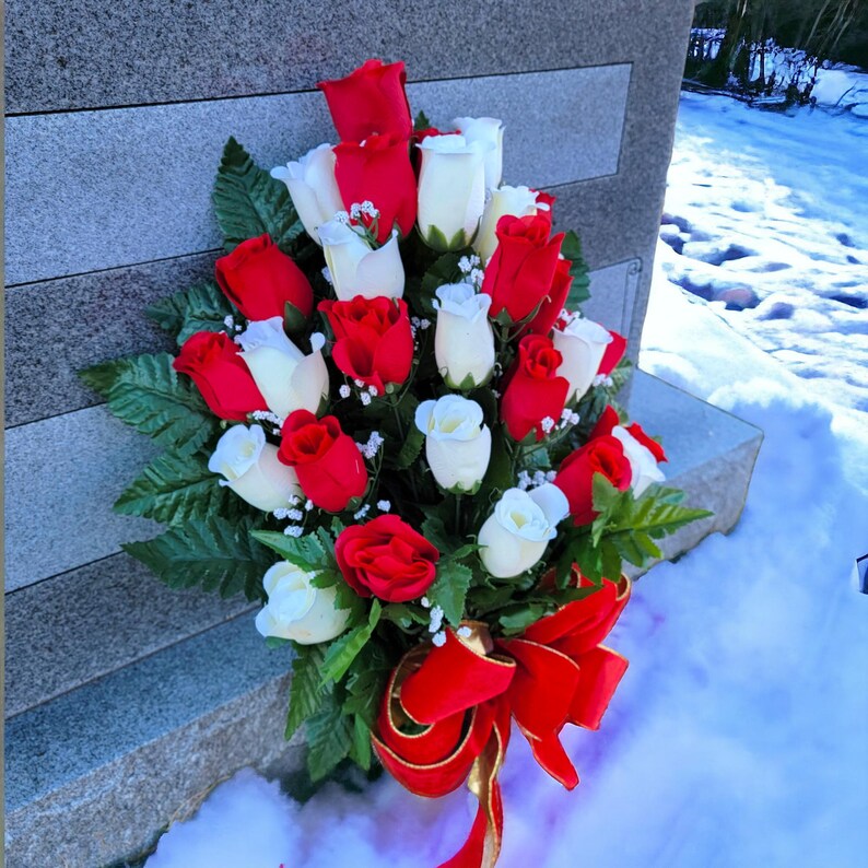 This Cemetery Cone Pair Has Grave Flowers Including Red and Cream White ...