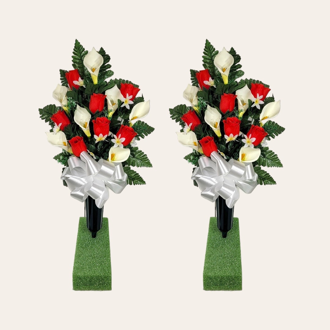 This Cemetery Cone Pair Has Grave Flowers Including Red Rosebuds and ...
