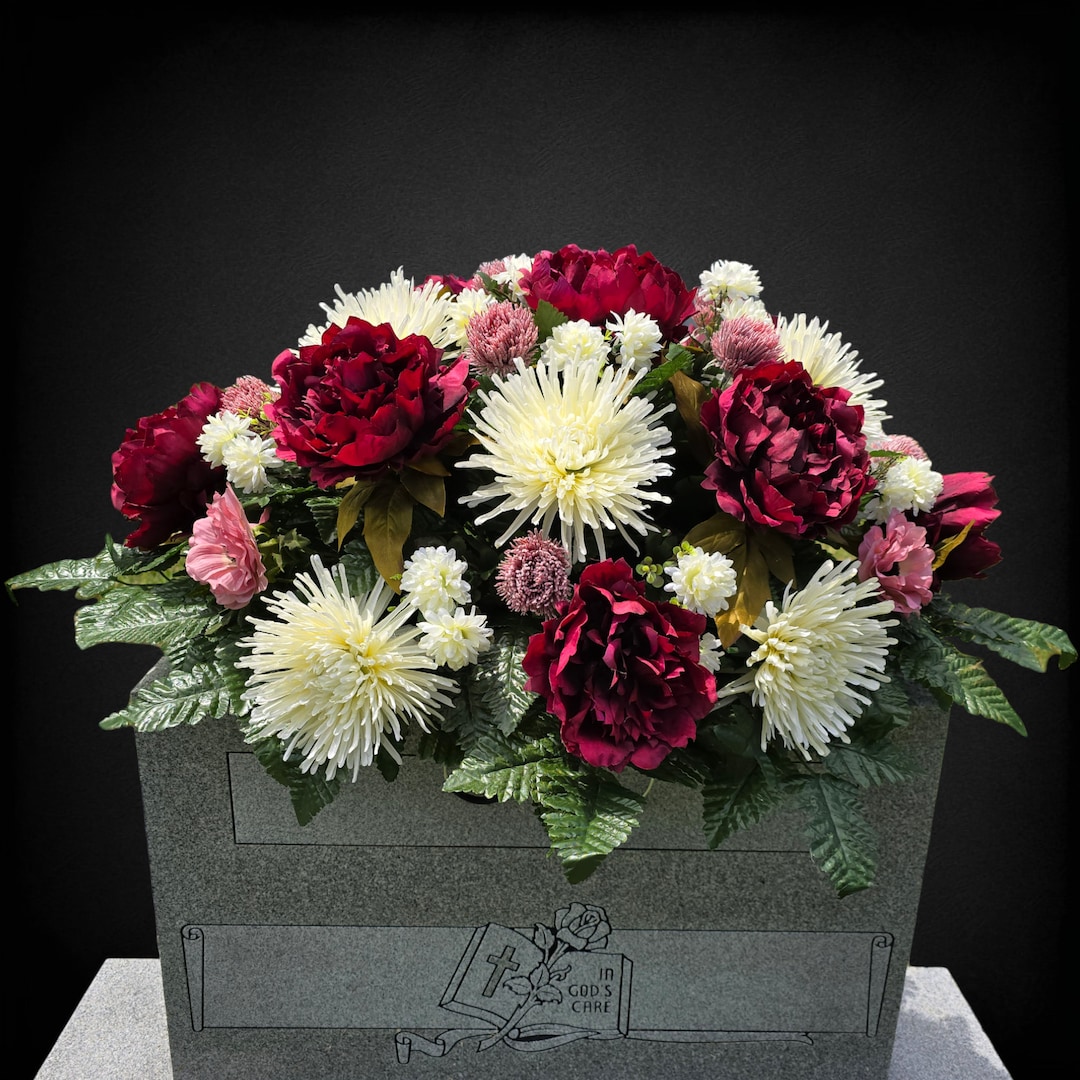 A Headstone Saddle With Peony, Spider Mum, and Anemone Grave Flowers ...