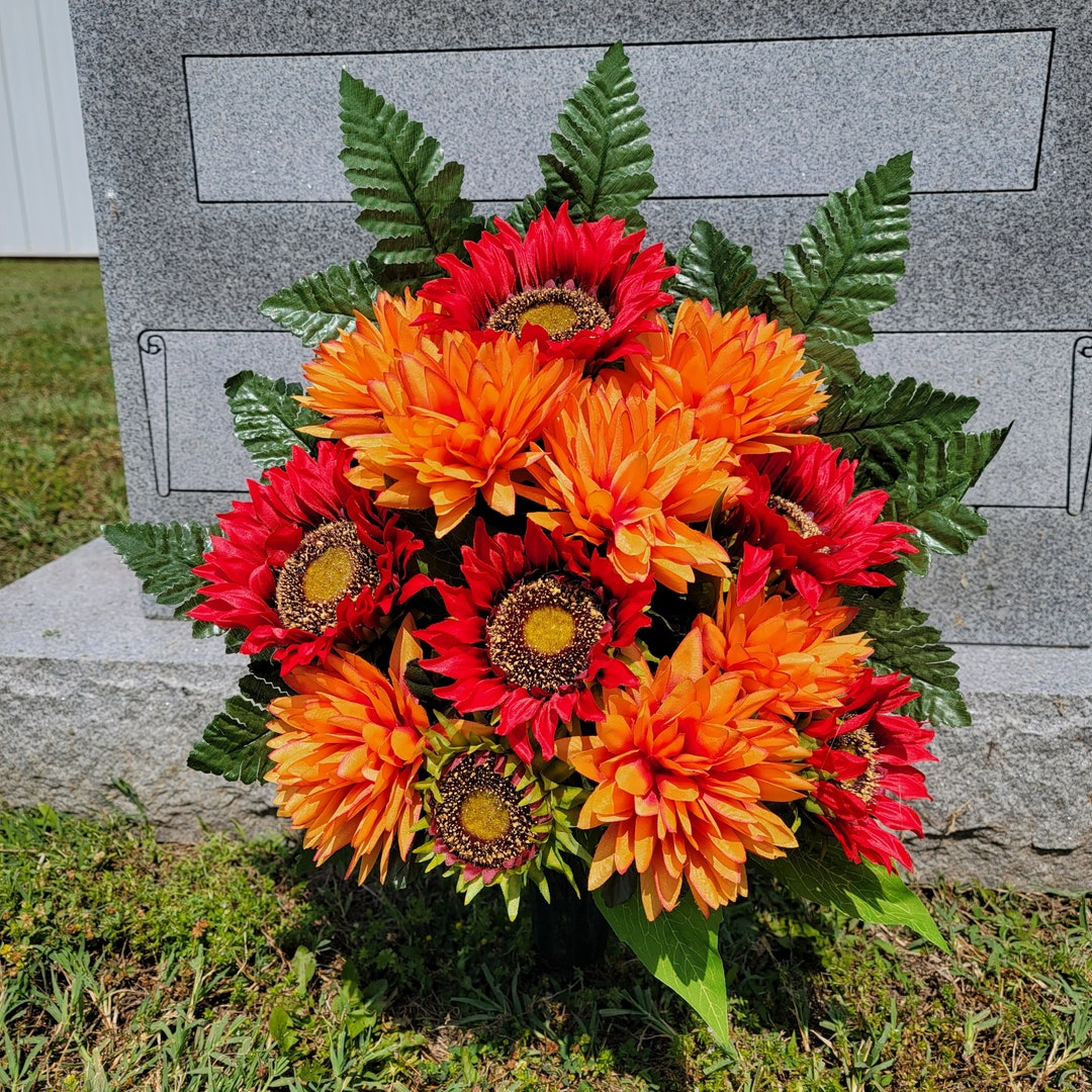 This Cemetery Cone Has Grave Flowers Including Red Sunflowers, Orange ...