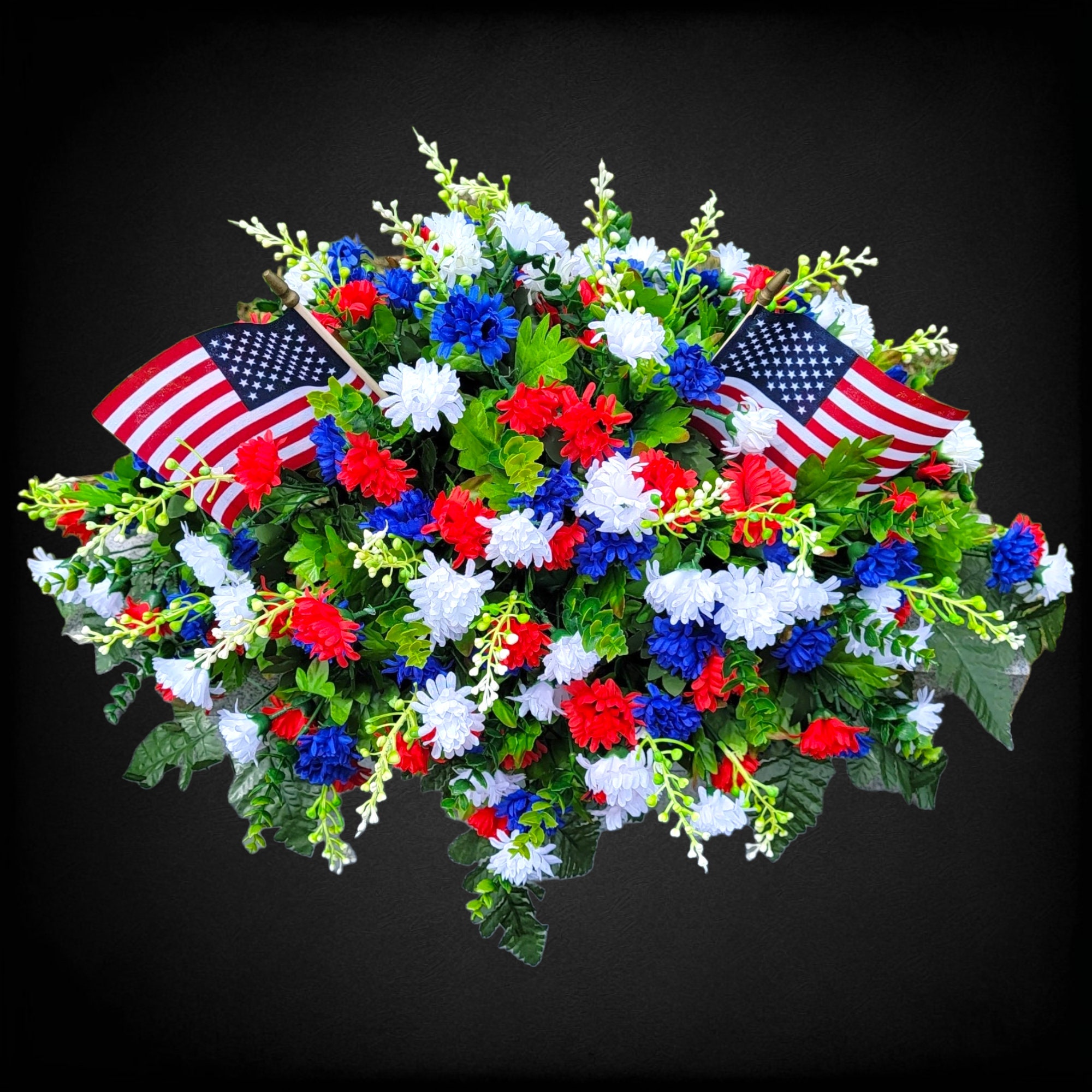 This Headstone Saddle Has Grave Flowers Including Red, White, & Blue ...