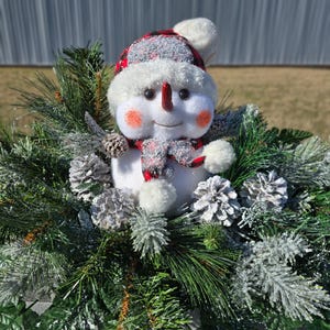 This Chubby Snowman Winter Cemetery Saddle Has Frosted Greenery and ...
