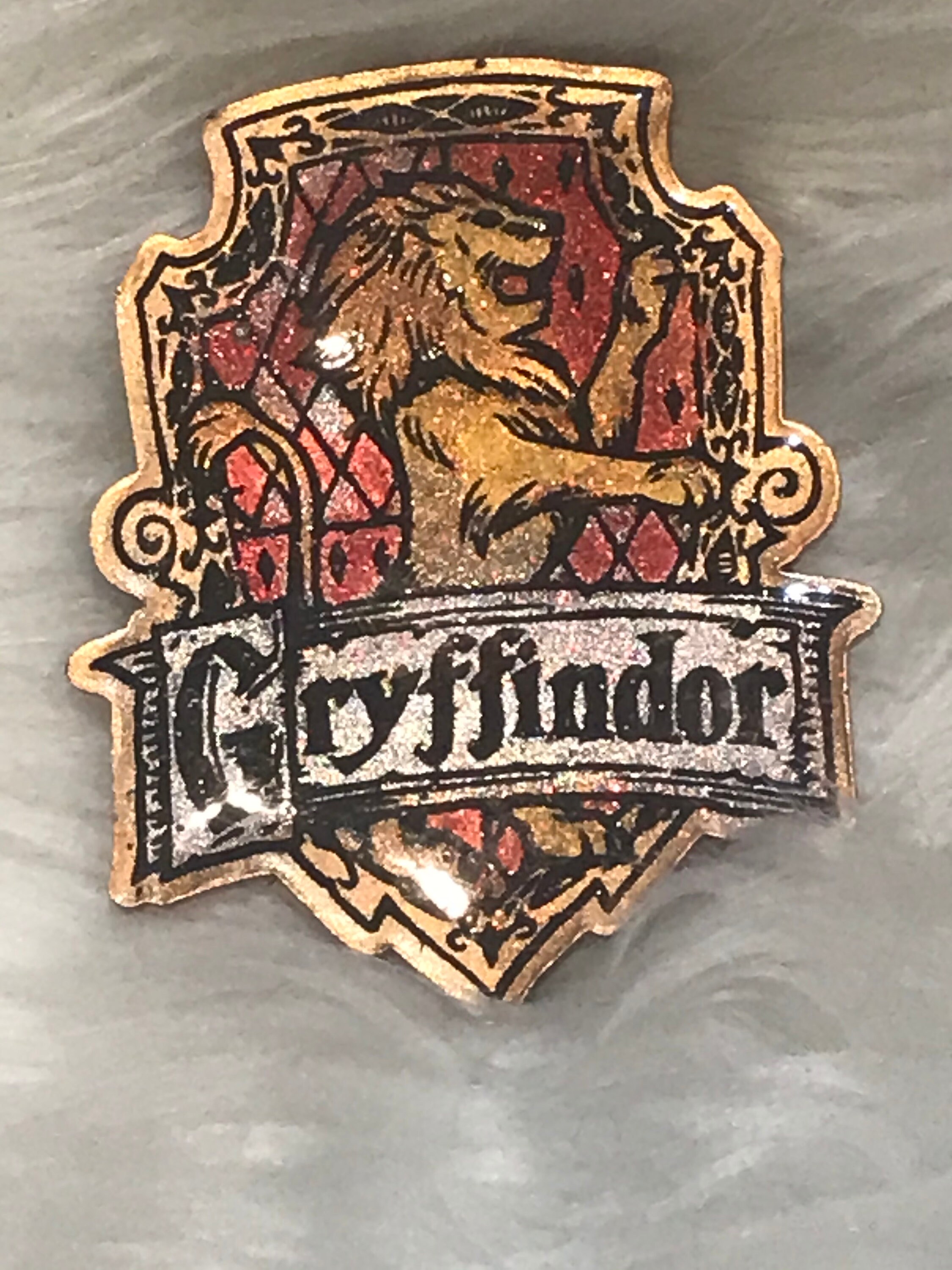 Gryffindor Harry Potter house Badge reel or phone grip | Etsy