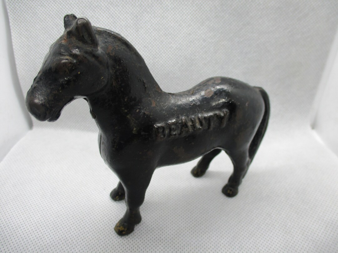 Small Black Beauty Cast Iron Coin Bank - Etsy