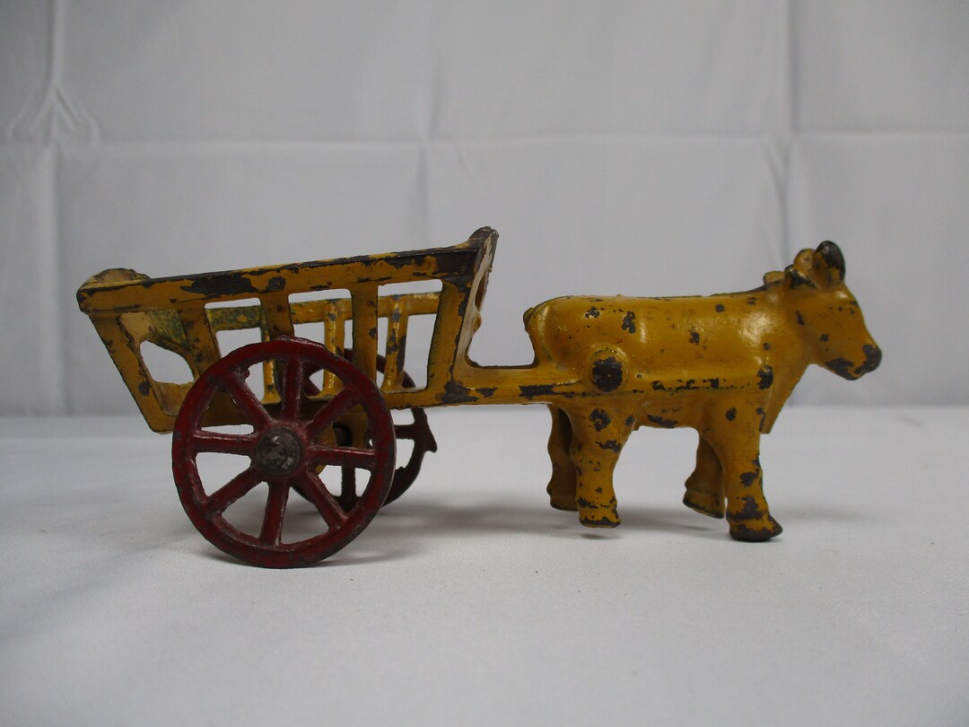 Yellow Cast Iron Ox Pulling a Cart Toy - Etsy