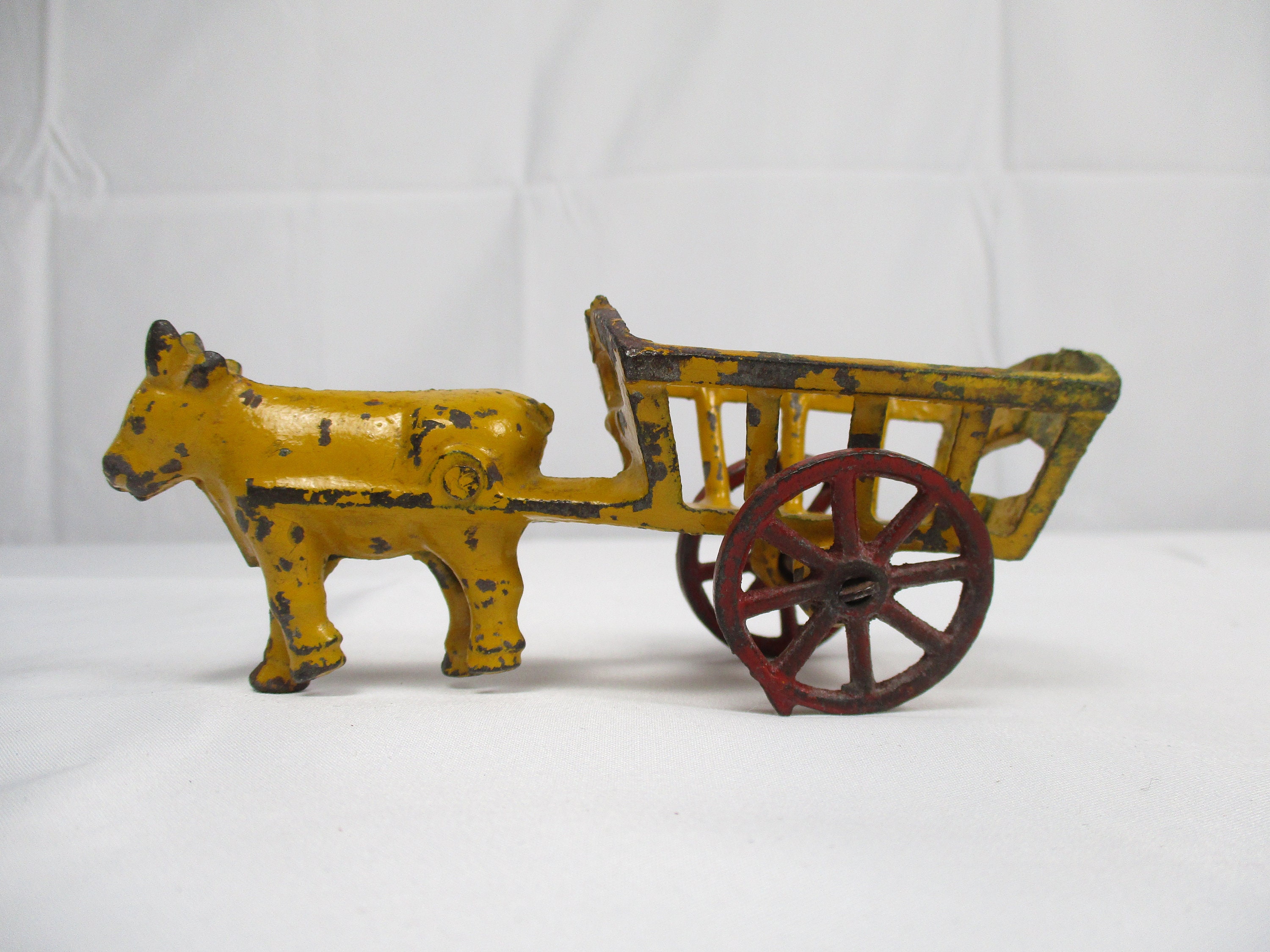 Yellow Cast Iron Ox Pulling a Cart Toy - Etsy