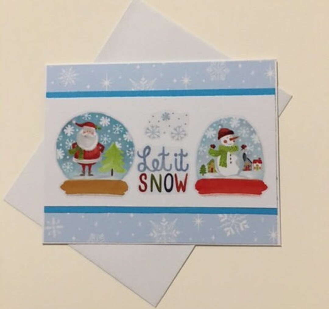 A Collection of Snow Globes. A Handmade Note Card That is Blank on the ...