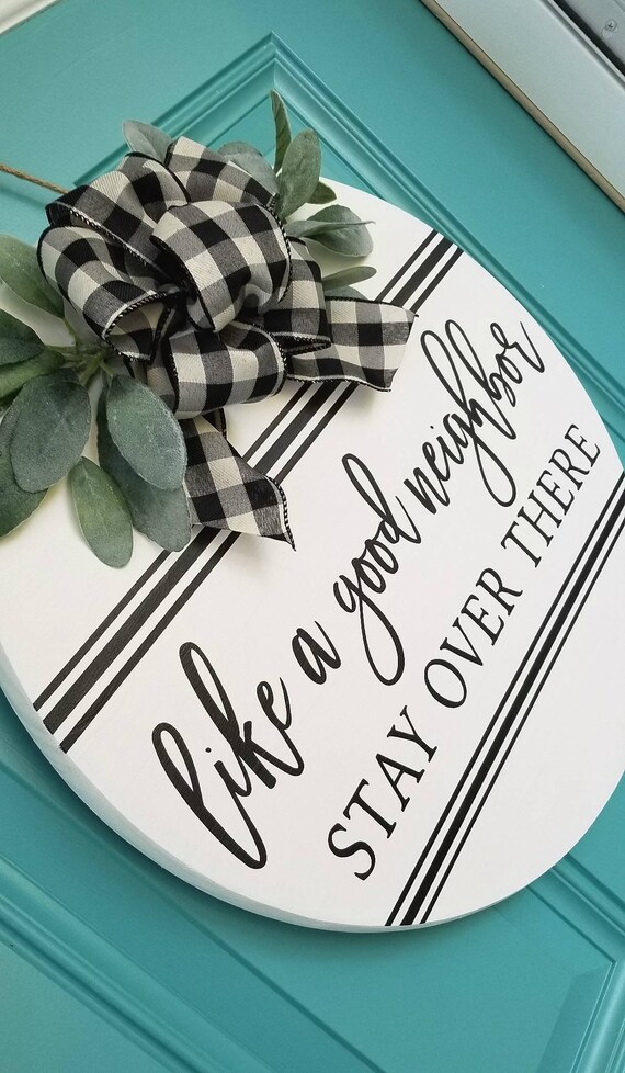 Wreaths & Door Hangers Like a Good Neighbor Stay Over There door hanger ...