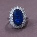 Silvertone Ring With Deep Cobalt Blue Centerstone Surrounded by Clear ...