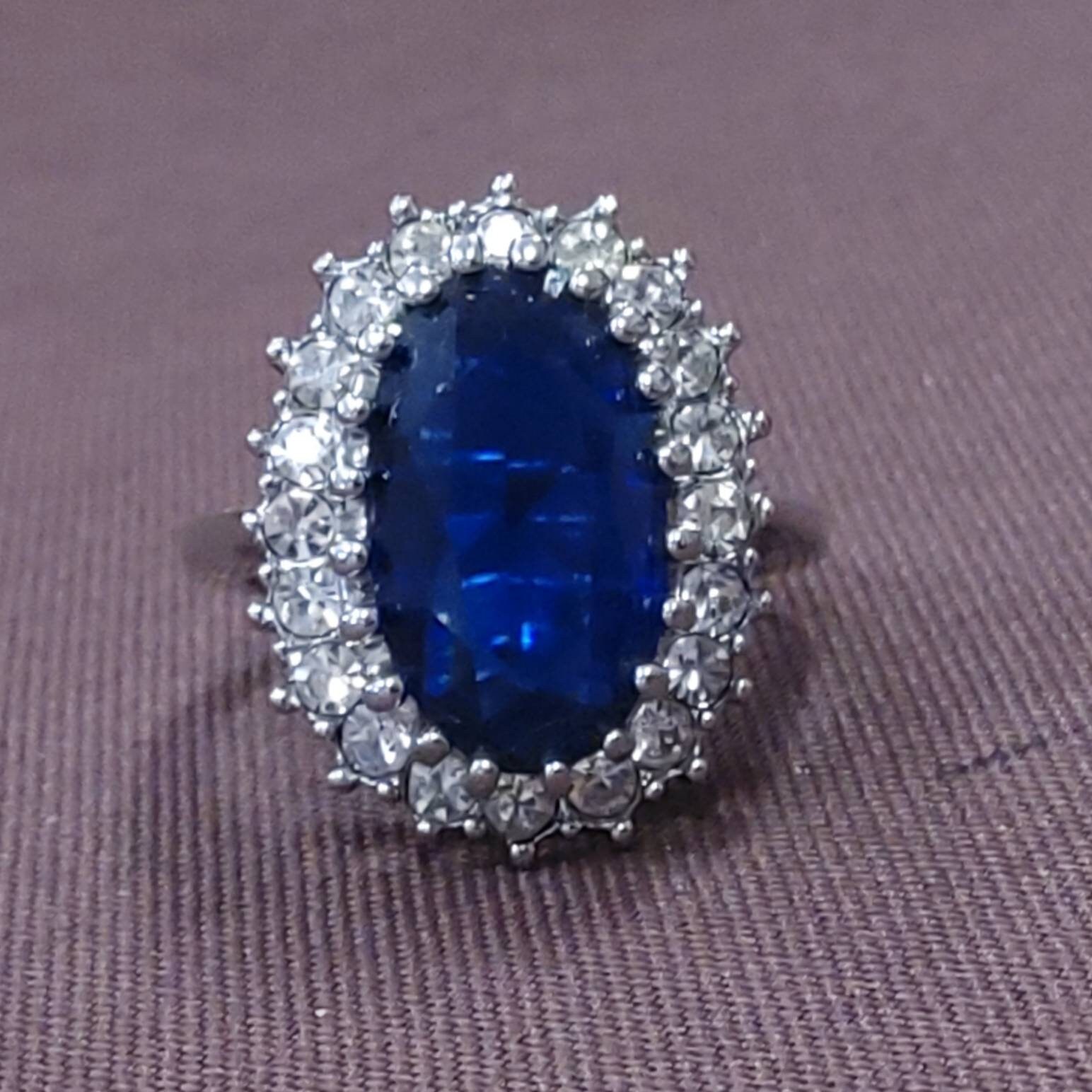 Silvertone Ring With Deep Cobalt Blue Centerstone Surrounded by Clear ...