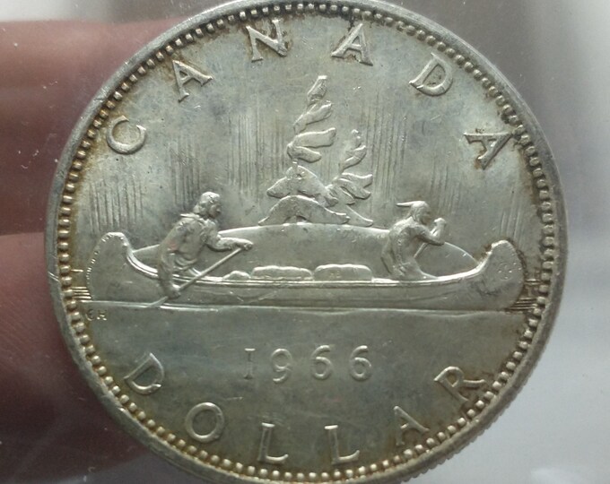 Canadian 1966 Silver Dollar. ICCS. Grade: MS65. Certificate# XWF 353 ...