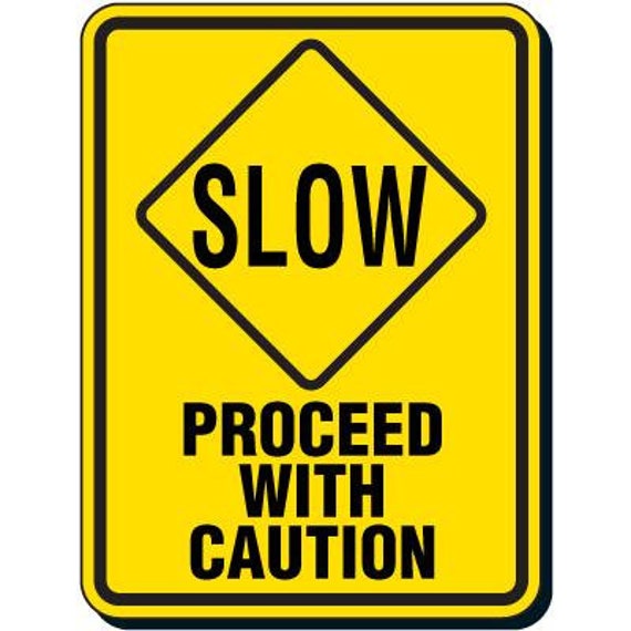 Proceed With Caution Road Sign