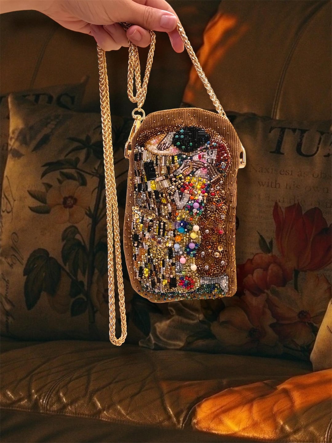 A Small, Brown, Beaded Purse With a Gold Chain Strap. the Purse ...