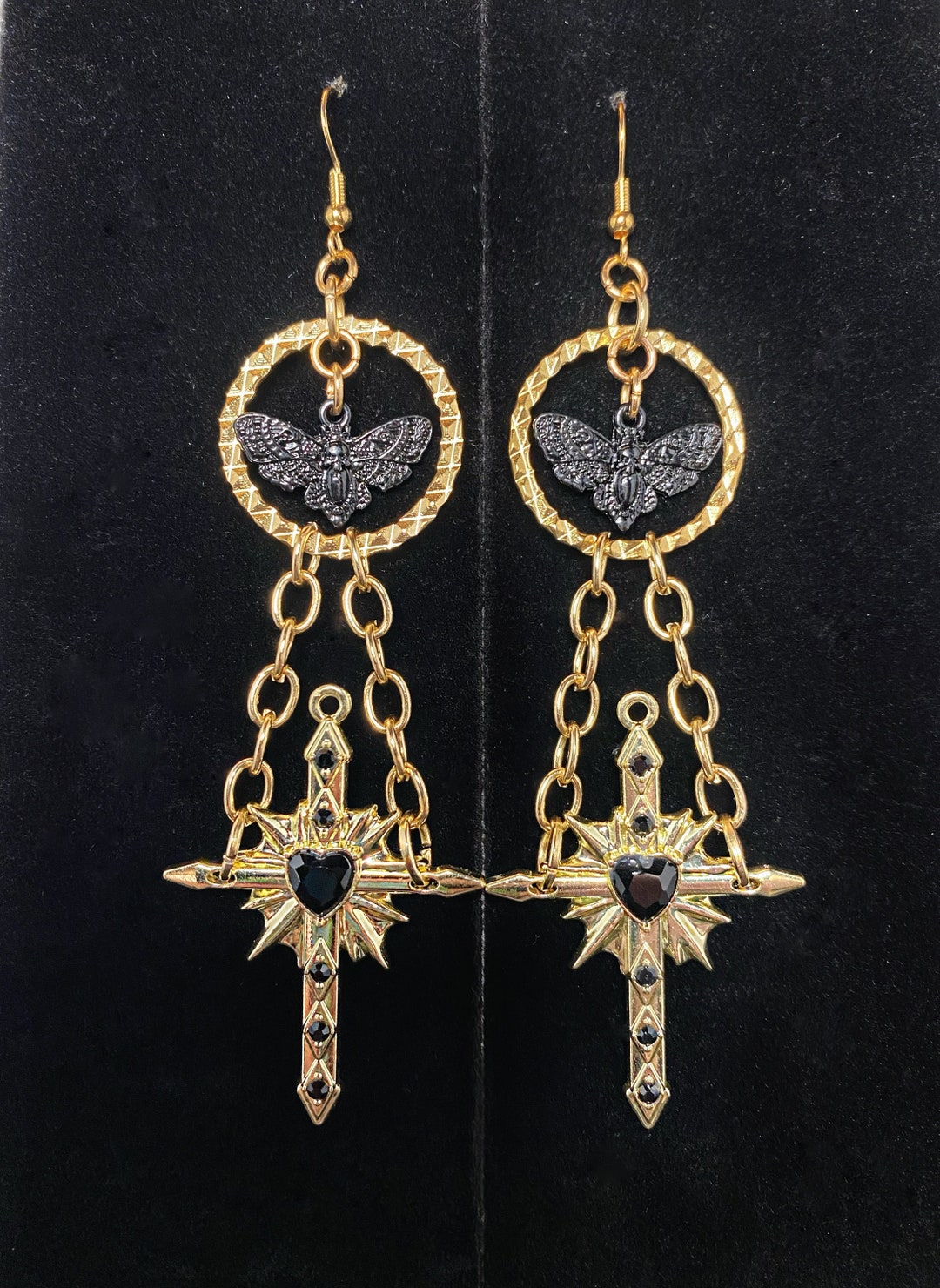 Black Witch’s Allure: Black Moth, Gold Cross and Black Heart With ...