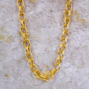 Gold Oval Link Chain Necklace With a Mix of Polished and Textured ...