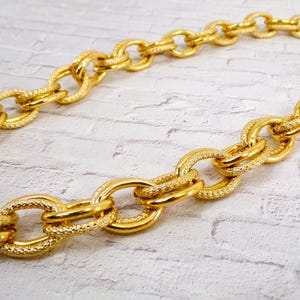 Gold Oval Link Chain Necklace With a Mix of Polished and Textured ...
